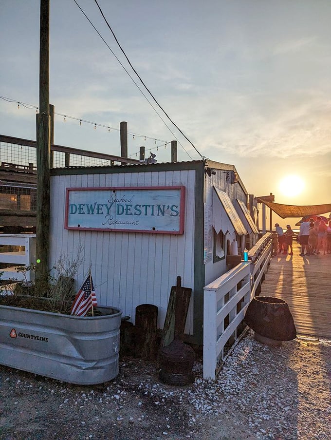 Golden hour at Dewey's – when the setting sun transforms a humble seafood shack into a postcard-perfect dining destination.