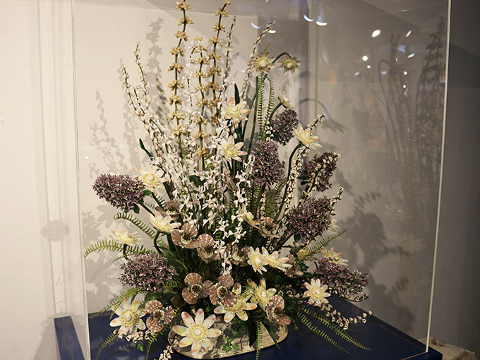 This stunning floral arrangement made entirely of shells transforms ocean treasures into botanical beauty, showcasing nature's versatile artistry.