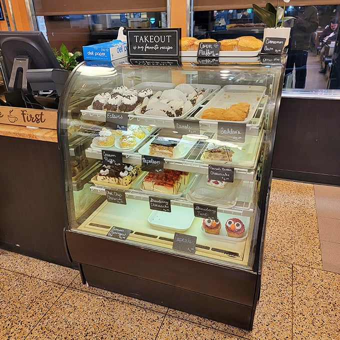 The dessert case—where willpower goes to die and "I'll just have coffee" transforms into "I'll take one of each, please."
