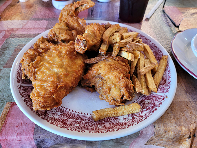 Fried chicken with a crust so perfectly golden and crisp, it makes a satisfying sound when your fork breaks through to the juicy meat within. 