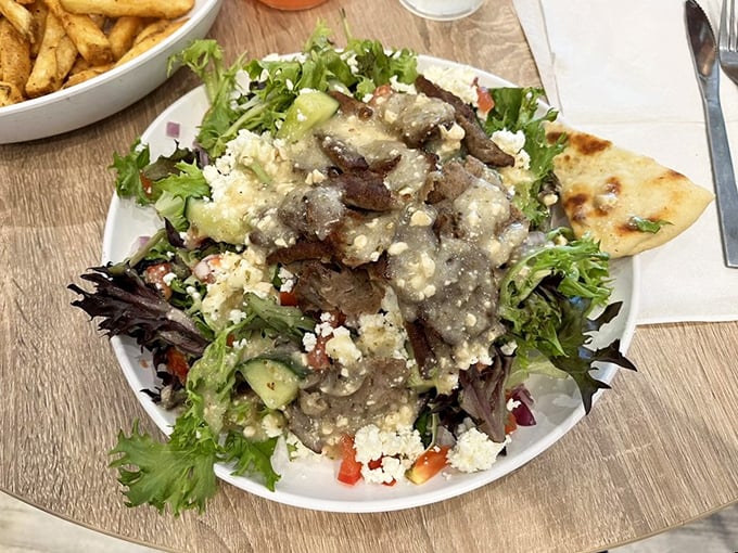 A Greek salad that transports you to the Mediterranean—crisp greens, feta, olives, and gyro meat creating a perfect harmony.