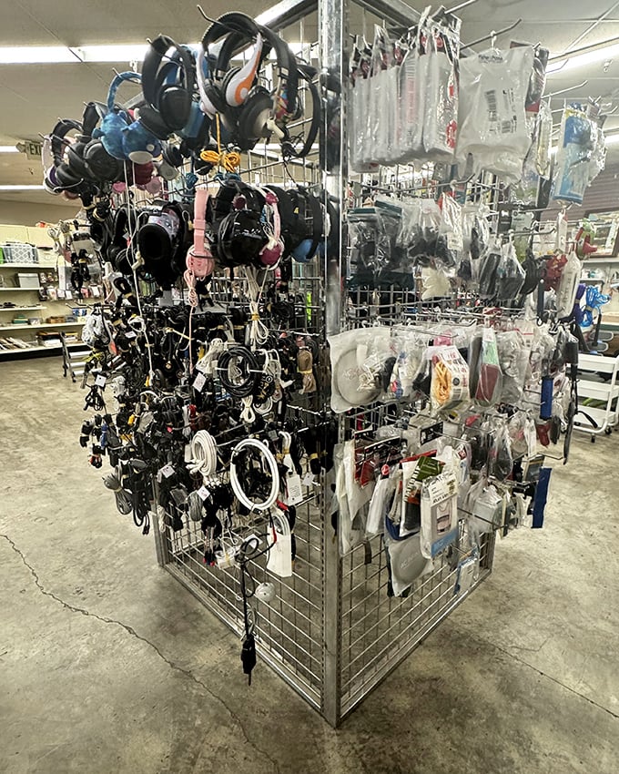 The accessories rack—a tangle of headphones, cables, and modern necessities. Yesterday's must-haves at tomorrow's garage sale prices.