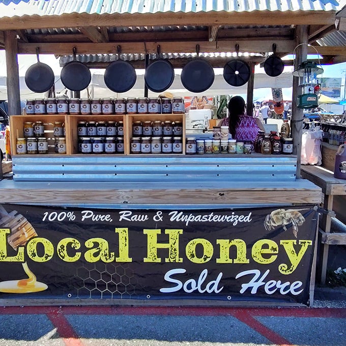 Liquid gold from Tennessee hills. Those cast iron skillets hanging above suggest exactly how to enjoy that local honey—on a fresh biscuit.