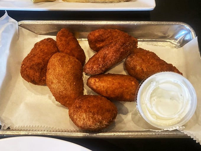 Golden-brown jalapeño poppers with cool dipping sauce—the perfect starter while you contemplate the serious business of breakfast selection.