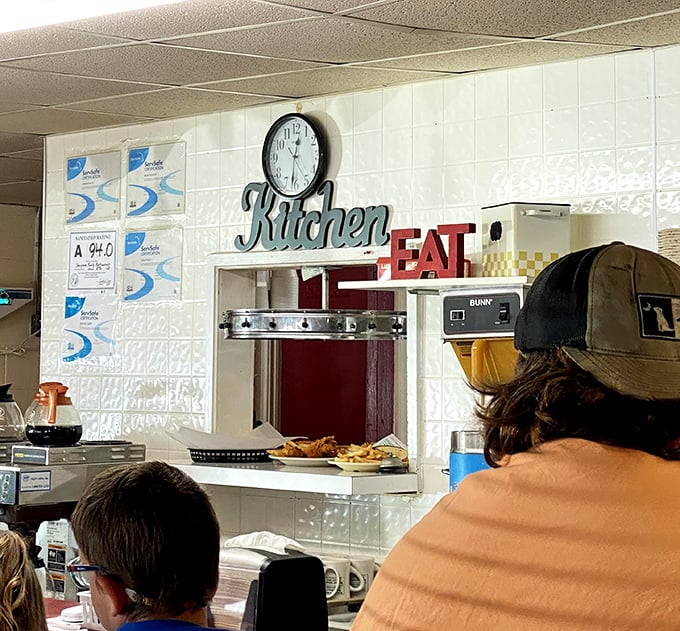 The pass-through window where breakfast dreams come true. No fancy terminology or garnishes—just hot plates delivered with care and efficiency.