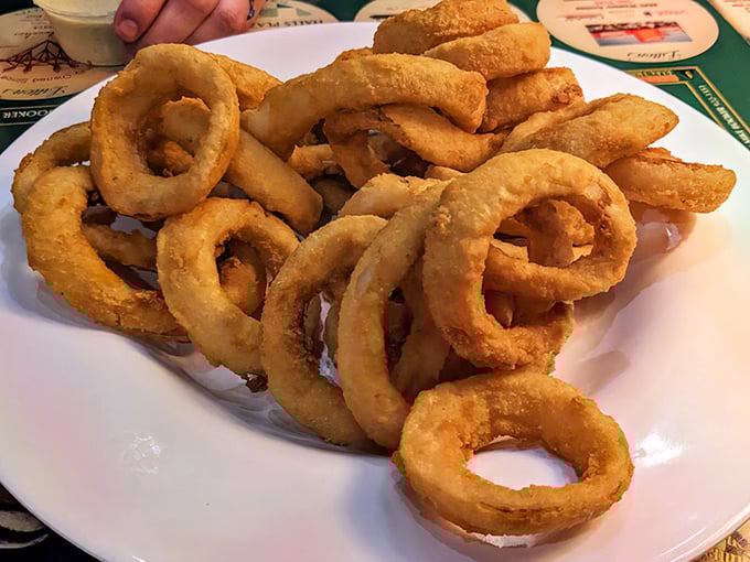 Onion rings so perfectly golden they could win beauty contests – crispy, sweet, and absolutely impossible to resist completely.