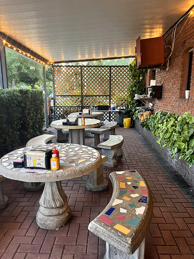 The outdoor patio offers a quirky Florida charm with its mosaic tables and lattice screens. A perfect spot for people-watching between bites.