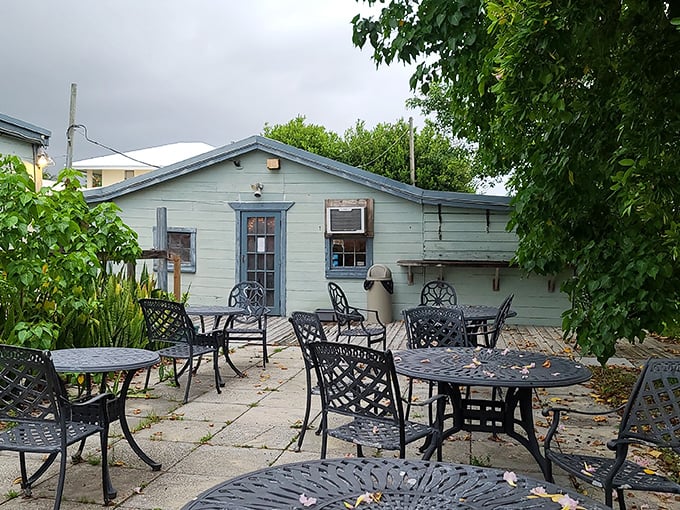The outdoor seating area offers a breath of salt air between courses, where conversations flow as freely as the nearby waters.