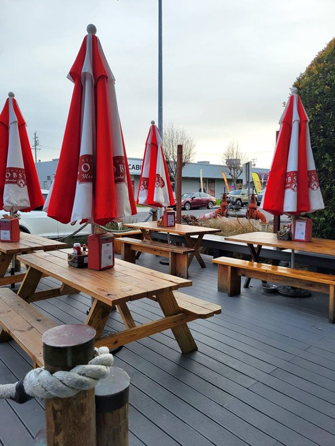 The outdoor deck where seafood therapy happens. Those picnic tables have witnessed more food euphoria than a cooking show highlight reel.