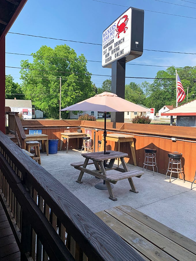 The outdoor seating area—where picnic tables and fresh air enhance every bite. That umbrella has shaded countless happy seafood moments.