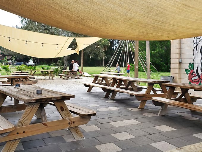 Al fresco dining under shade sails where the only thing better than the food is the Florida breeze carrying conversations between picnic tables.