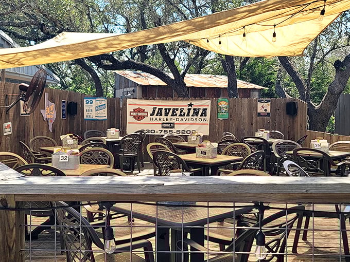 Outdoor tables where memories are made, under signs that remind you you're deep in the heart of Texas.