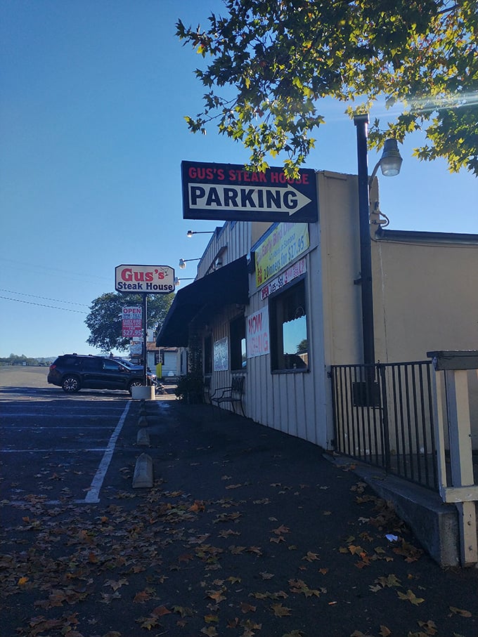 Even the parking lot has that classic small-town charm. Fallen leaves create nature's welcome mat for hungry visitors arriving for their steak fix.
