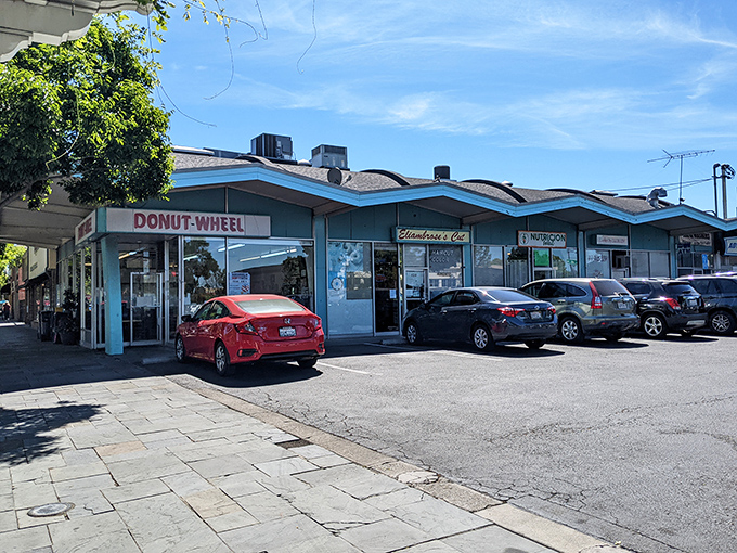 By day, a bustling strip mall spot where cars gather like pilgrims at a sugar shrine. Worth every mile of the journey.