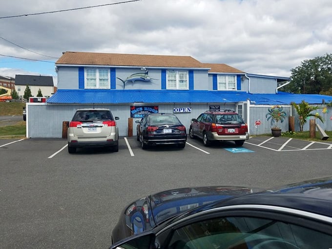 The blue marlin painted on the facade serves as a beacon for hungry travelers—maritime GPS for those seeking seafood salvation.