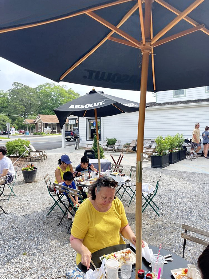 Al fresco dining where gravel crunches underfoot and umbrellas provide shade—the perfect setting for savoring every bite without rushing.