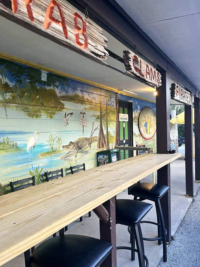 Outdoor seating with a side of Florida wildlife murals—because dining without alligator art just doesn't feel authentic in these parts.