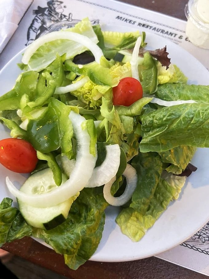 A crisp house salad that knows its supporting role—refreshing enough to enjoy, simple enough not to distract from the seafood main event.