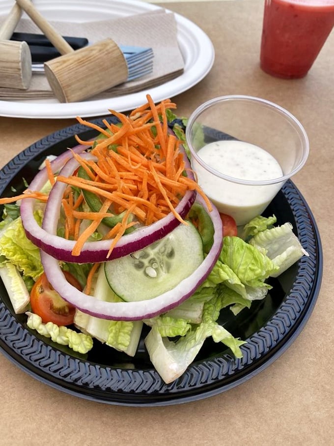 Even the salad gets special treatment – crisp, colorful, and ready to provide the illusion of healthfulness before diving back into seafood territory.