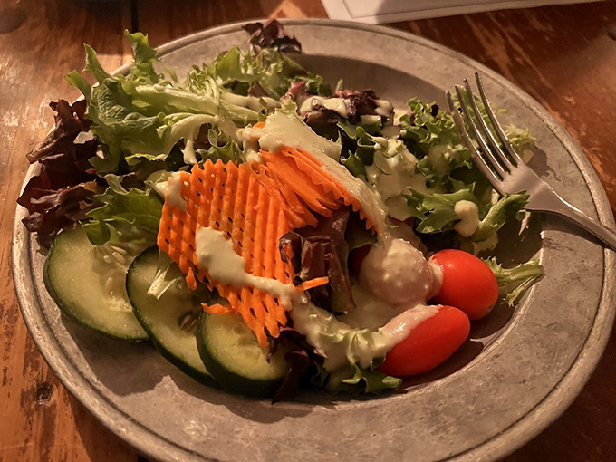 Even the house salad refuses to be ordinary. Fresh vegetables arranged with the care usually reserved for main courses.