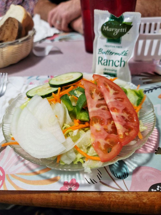 Garden-fresh salad that somehow makes you feel virtuous while waiting for your fried chicken—the culinary equivalent of reading War and Peace before binge-watching reality TV.