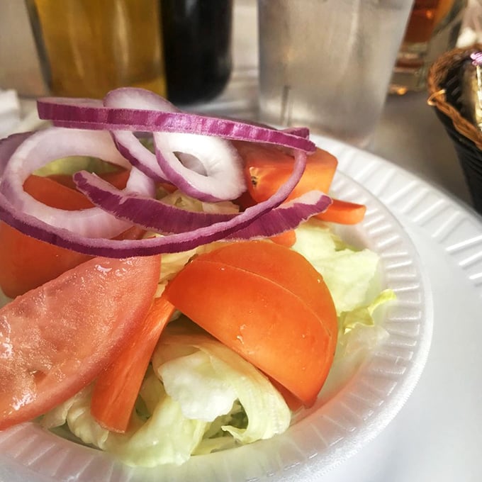 A side salad that knows its role – bright, crisp, and ready to provide the perfect palate-cleansing counterpoint to rich seafood.