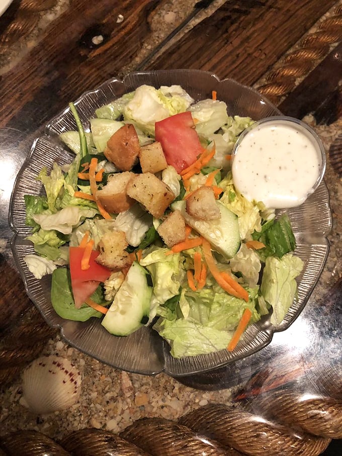 A garden of crispness in a glass bowl. This isn't just a side salad—it's the supporting actor that deserves its own award.