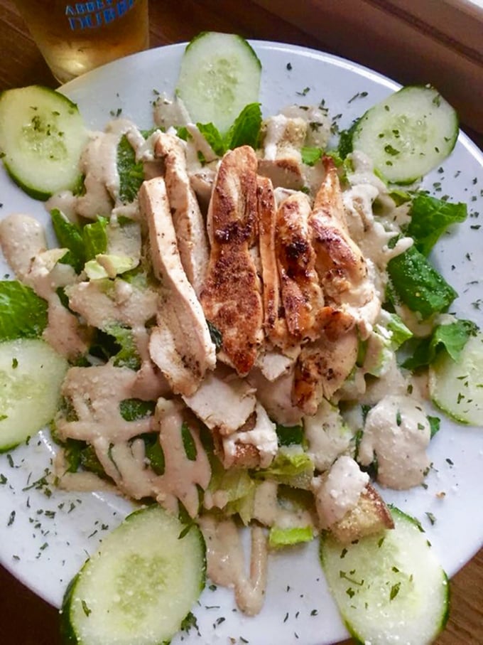 A fresh salad with grilled chicken offers a lighter option without sacrificing flavor—because balance is important, even in tavern dining.