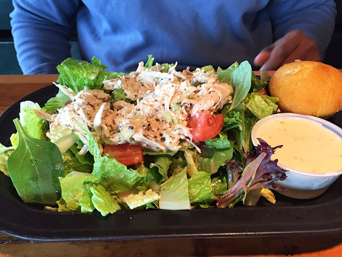 Not just a token salad—a legitimate contender featuring smoky pulled chicken that might make you temporarily forget about those ribs you ordered.