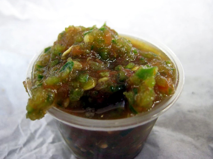 The legendary salsa—a perfect balance of heat, acidity, and freshness that elevates everything it touches. Worth requesting extra containers.
