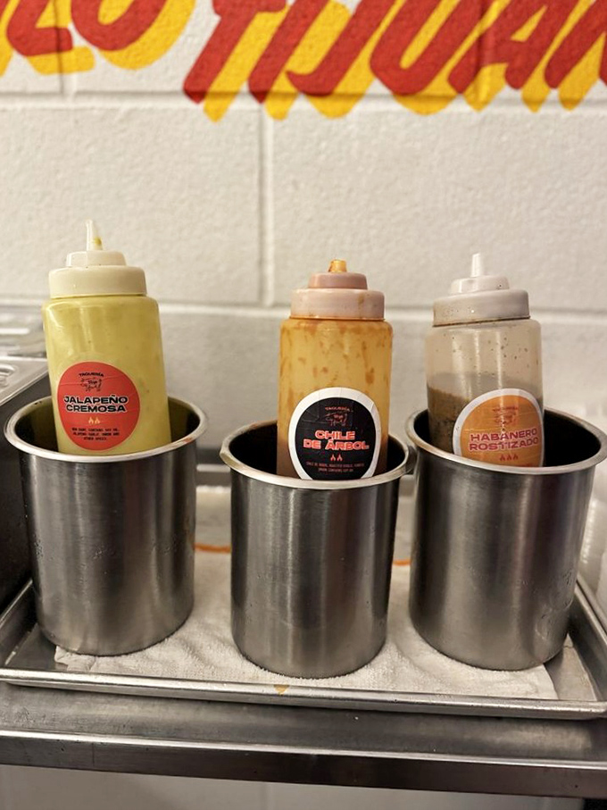 The holy trinity of sauces—jalapeño, chile de árbol, and habanero—each waiting to transform your taco from delicious to transcendent.