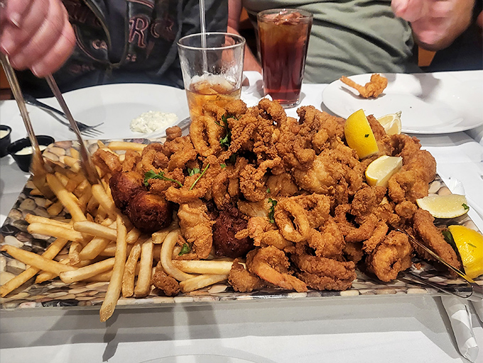 The seafood platter that makes sharing impossible. Those golden-fried treasures deserve your full, undivided attention.