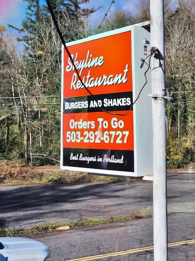 The roadside sign makes a bold claim about Portland's best burgers—and after one bite, you'll find yourself nodding in complete agreement.