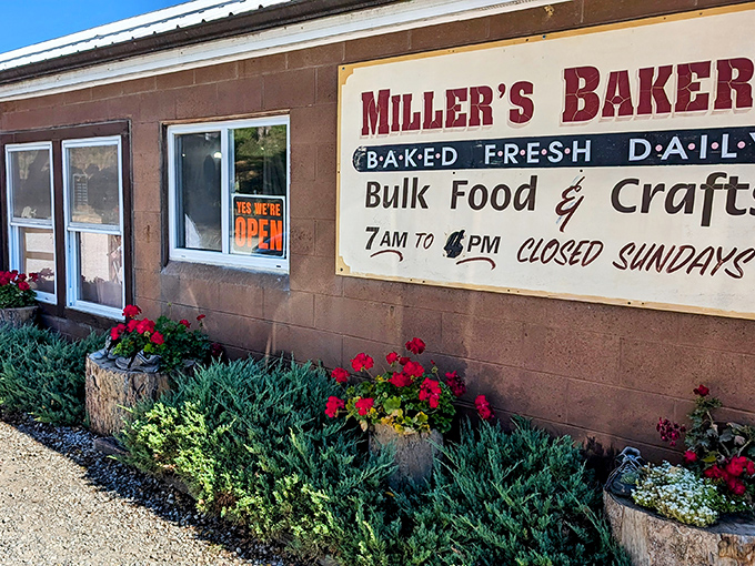 The sign promises "Baked Fresh Daily" – four simple words that translate to "prepare your taste buds for an experience they'll never forget."