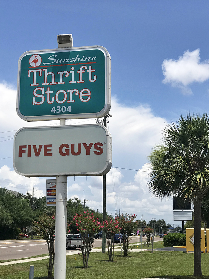 The roadside sign shares space with Five Guys, creating the perfect "treat yourself, then save money" Florida afternoon itinerary.