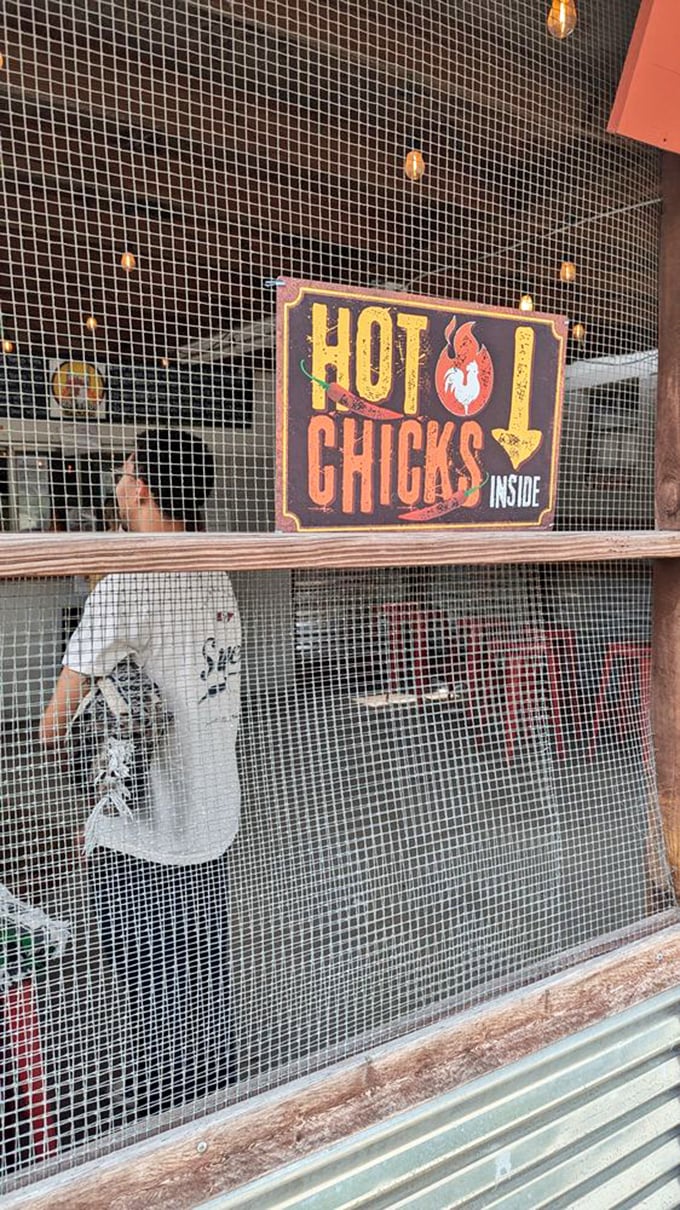 "Hot Chicks Inside" isn't just clever signage—it's truth in advertising. The mesh screen separating you from chicken paradise only heightens the anticipation.
