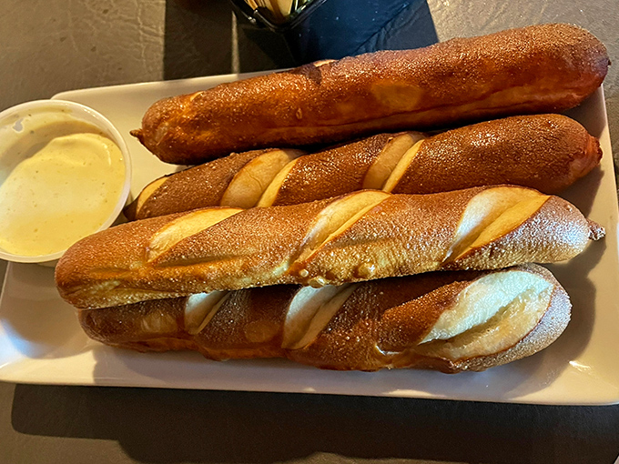 These pretzels aren't twisted—they're perfectly straightforward in their mission to deliver soft, chewy perfection with a side of creamy dip.