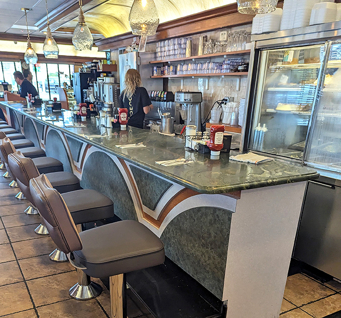 Where diner magic happens – the counter service area where coffee is always fresh and the staff knows regulars by their breakfast preferences.