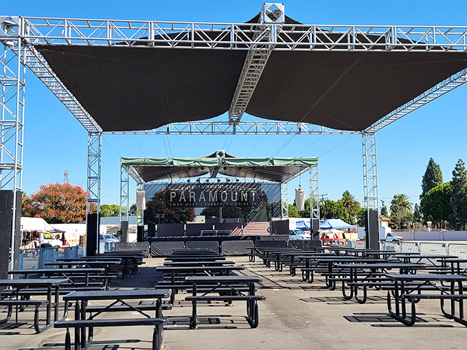 The swap meet's stage area, where community events and performances add entertainment value to the shopping experience.