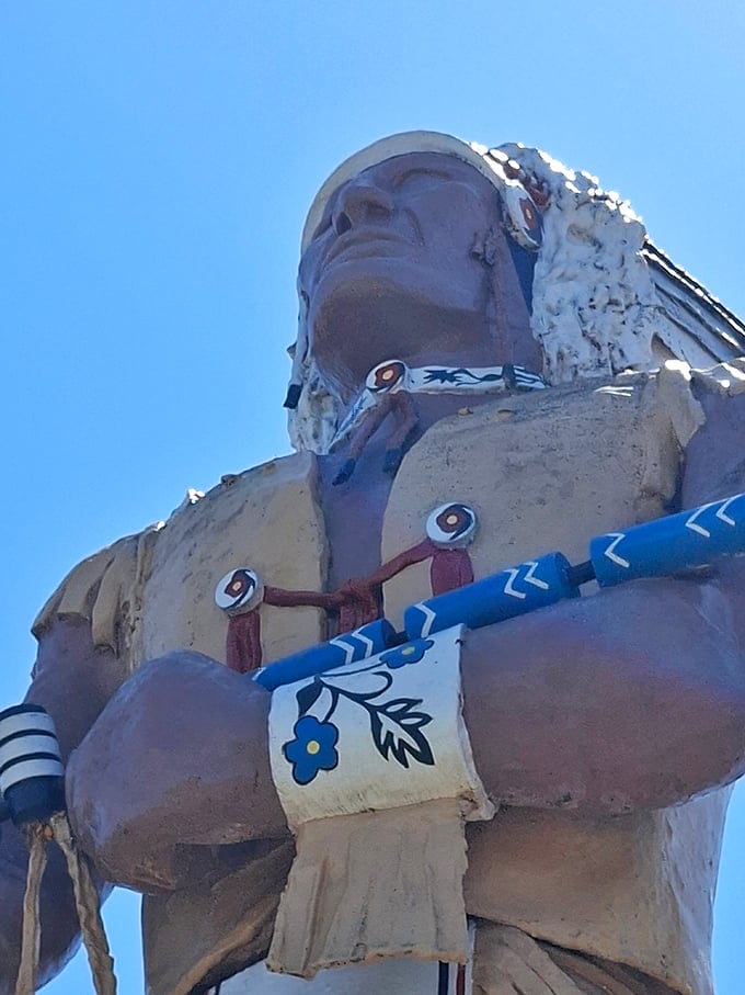 Detail work that demands a double-take: The intricate designs on Hiawatha's ceremonial pipe and wristbands required scaffolding just to paint.
