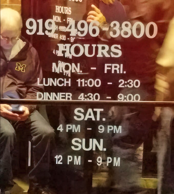 Operating hours posted clearly—because knowing when you can get your next prime rib fix is essential information.