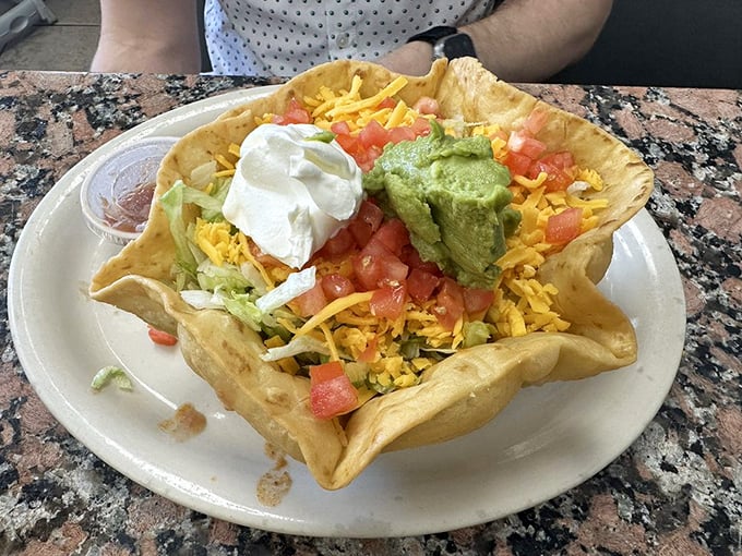 Taco salad served in a freshly fried tortilla bowl—because in Texas, even salads deserve a crunchy, edible vessel. That's not just lunch, it's an experience.