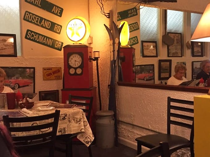That vintage Texaco pump isn't pumping gas, but it's fueling nostalgia. Street signs and memorabilia transport diners to simpler times.