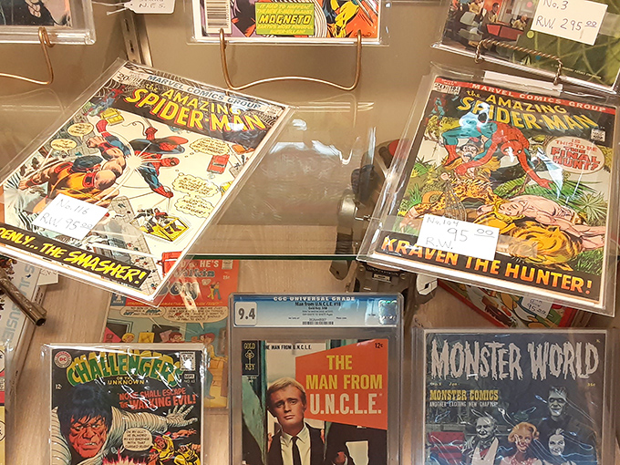 Comic book time capsules preserved behind glass. Spider-Man was fighting villains long before he swung across IMAX screens.