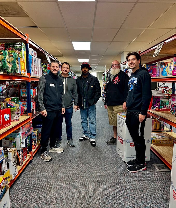Community in action—volunteers and visitors sharing the joy of discovery between aisles of potential treasures.