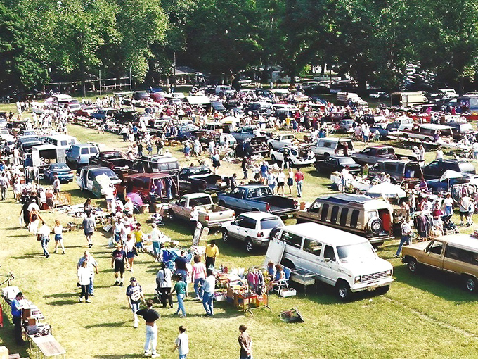 The grand tapestry of commerce unfolds from above—hundreds of vehicles, thousands of treasures, and endless possibilities under Pennsylvania trees.