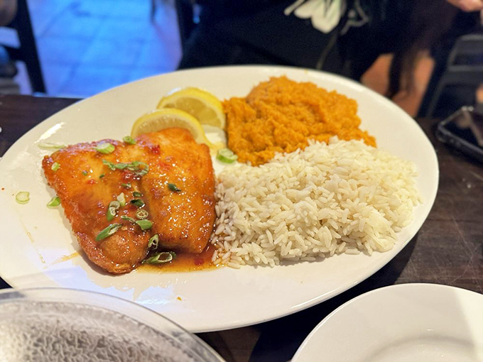 This isn't just fish—it's a vacation on a plate. Sweet potato, rice, and perfectly cooked salmon create the Florida trifecta.