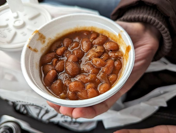 These aren't your campfire beans—they're deeply flavored legumes that have been hanging out with the cool kids (brisket trimmings) and absorbed their smoky wisdom.