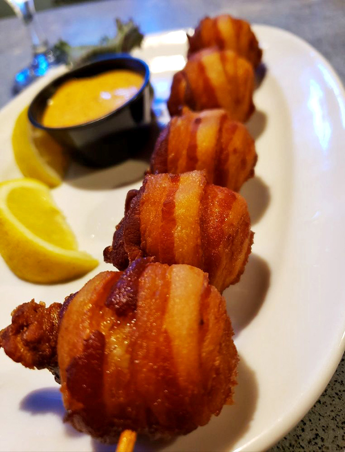 Bacon-wrapped scallops: proof that sometimes the ocean and the farm should absolutely collaborate, resulting in bite-sized perfection with a side of heaven.