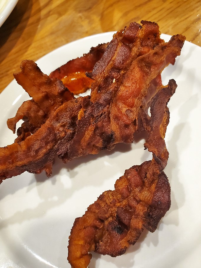 Bacon cooked to that perfect point between chewy and crisp. Not just a side dish—it's the reason many of us get out of bed.